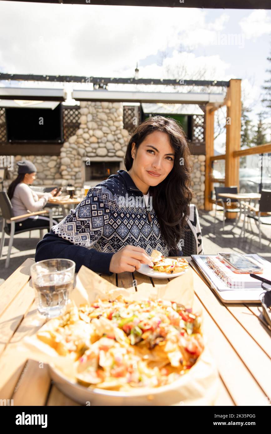 Woman eating food outside hi-res stock photography and images - Alamy