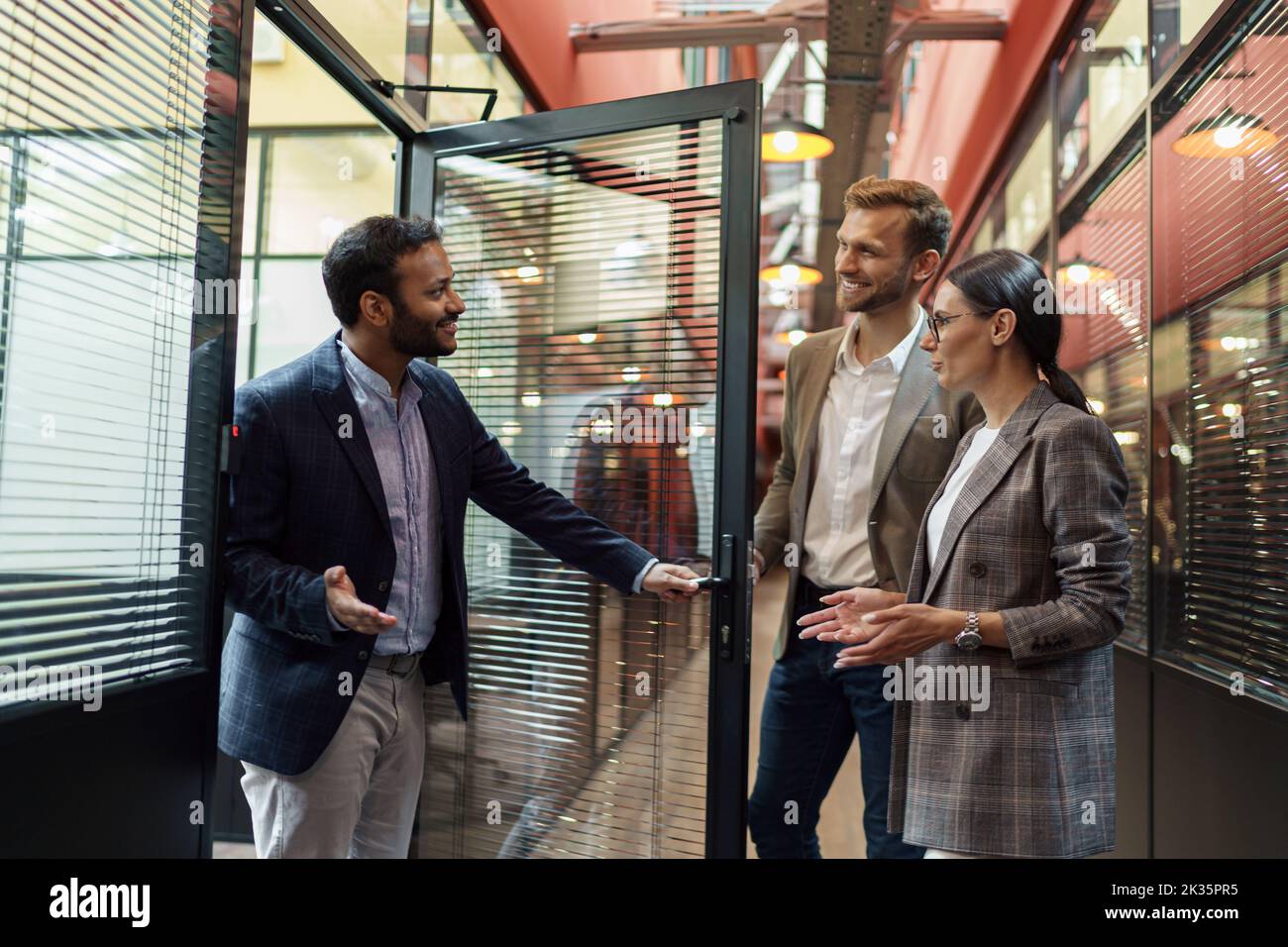 successful businessman invites you to the office Stock Photo - Alamy