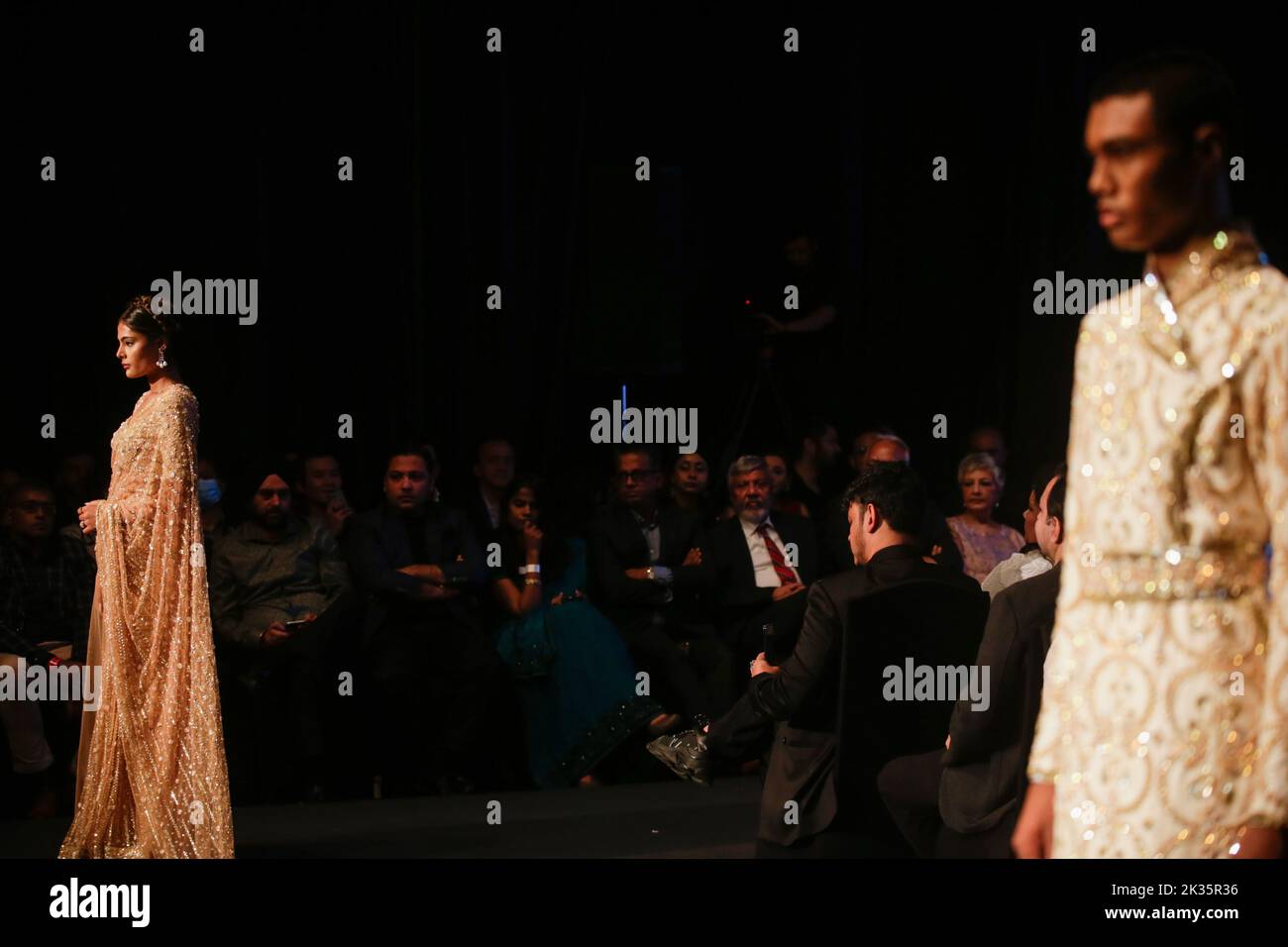 A model walks the runway wearing designer collections on the last day ...