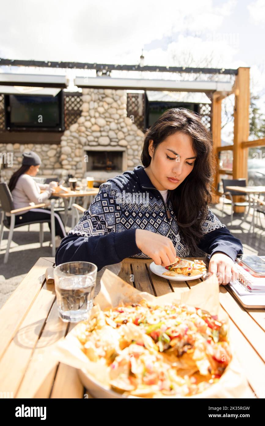 Woman eating food outside hi-res stock photography and images - Alamy