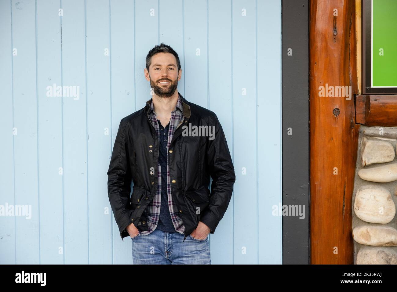 Man standing next to door of hi-res stock photography and images - Alamy