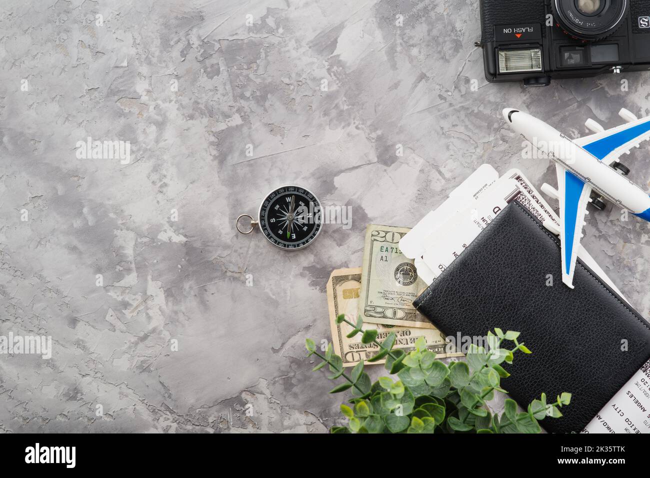 Travel preparation. Money, documents, tickets, compass on a gray ...