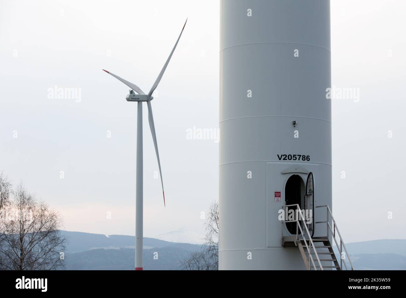 Wind farm and open entrance door to the wind turbine seen in Zlata ...