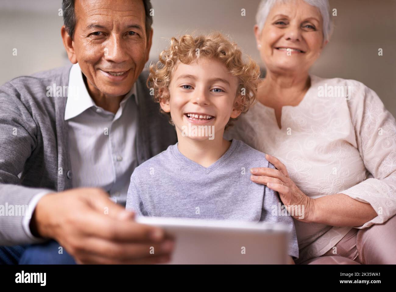 Child and ipad and grandparents hi-res stock photography and images - Alamy