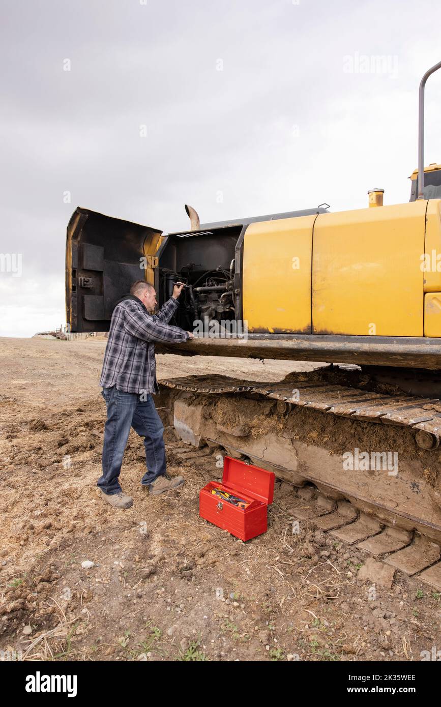 Mechanic working on farm equipment hi-res stock photography and images ...