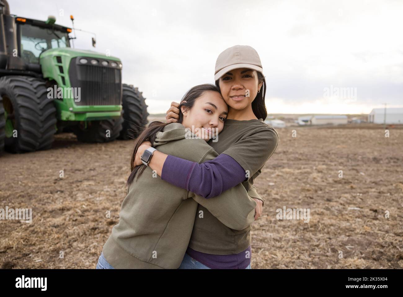 Farmer hugging daughter in field hi-res stock photography and images ...