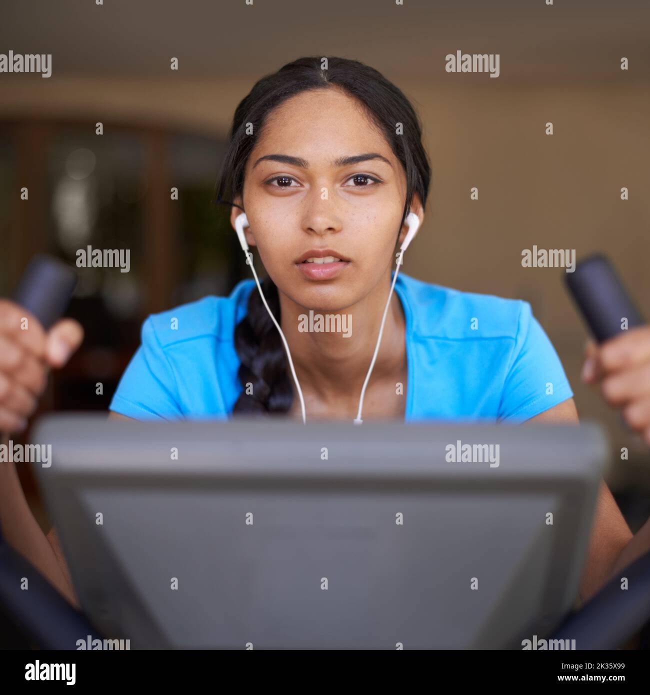 Full body workout. a young ethnic woman working out in the gym on a ...
