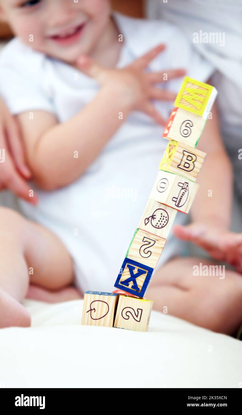 Child growth and development. a stack of building blocks in front of a ...