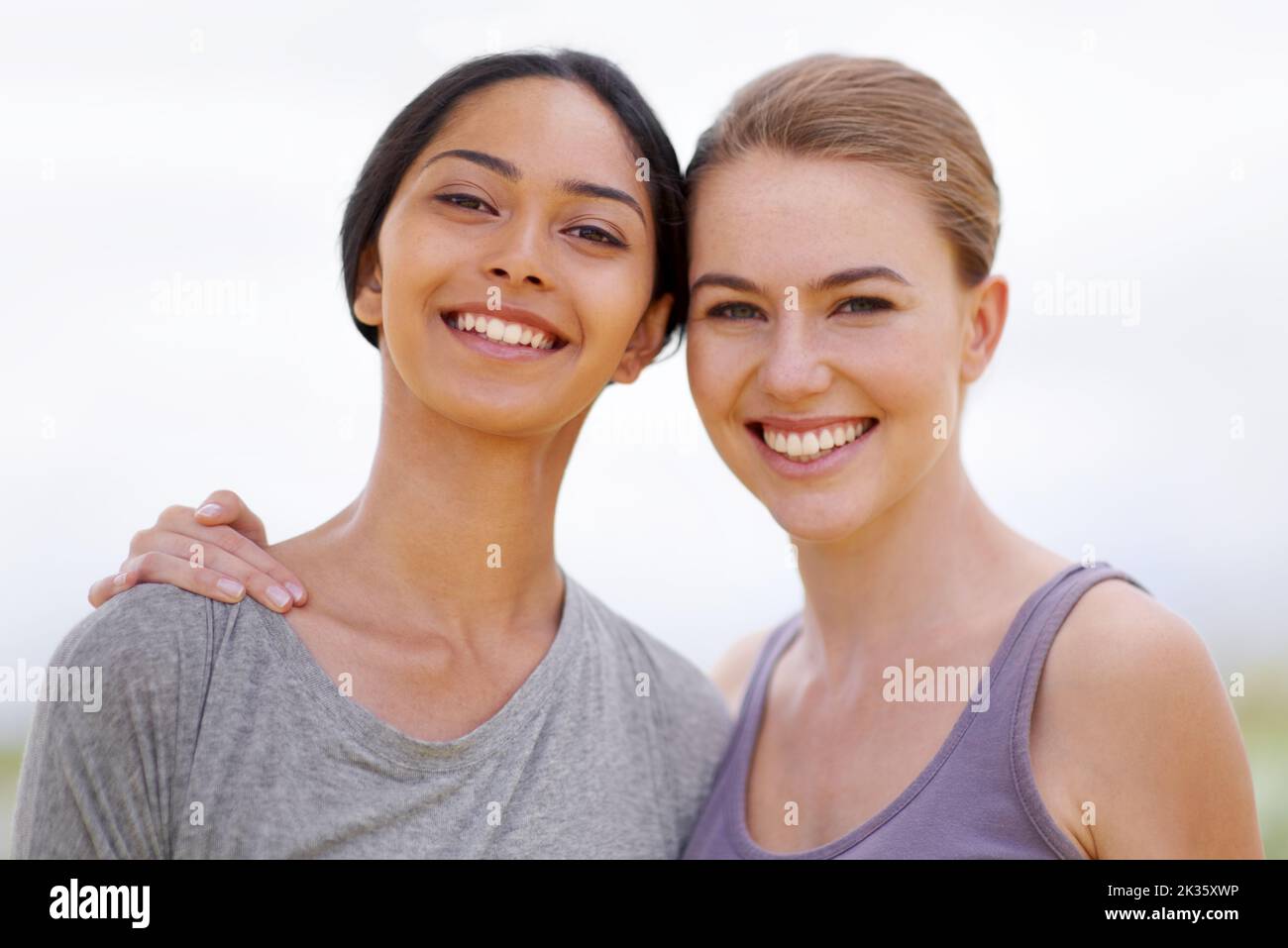 Staying fit together. A portrait of two young ladies smiling together ...