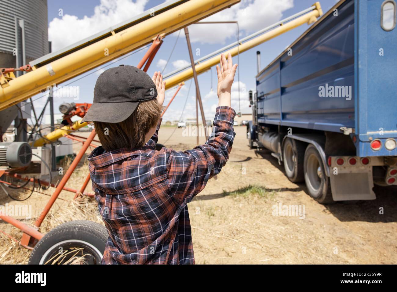 Boy on tractor hi-res stock photography and images - Alamy