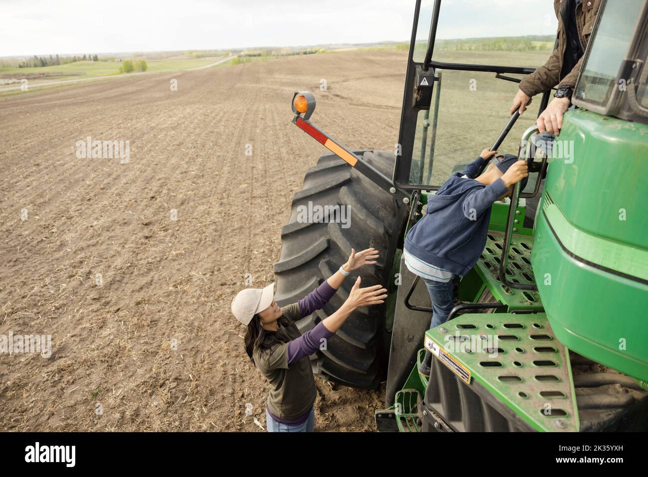 Boy standing on ladder hi-res stock photography and images - Alamy