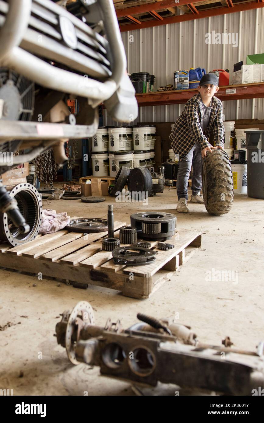 Rolling a tire hi-res stock photography and images - Alamy