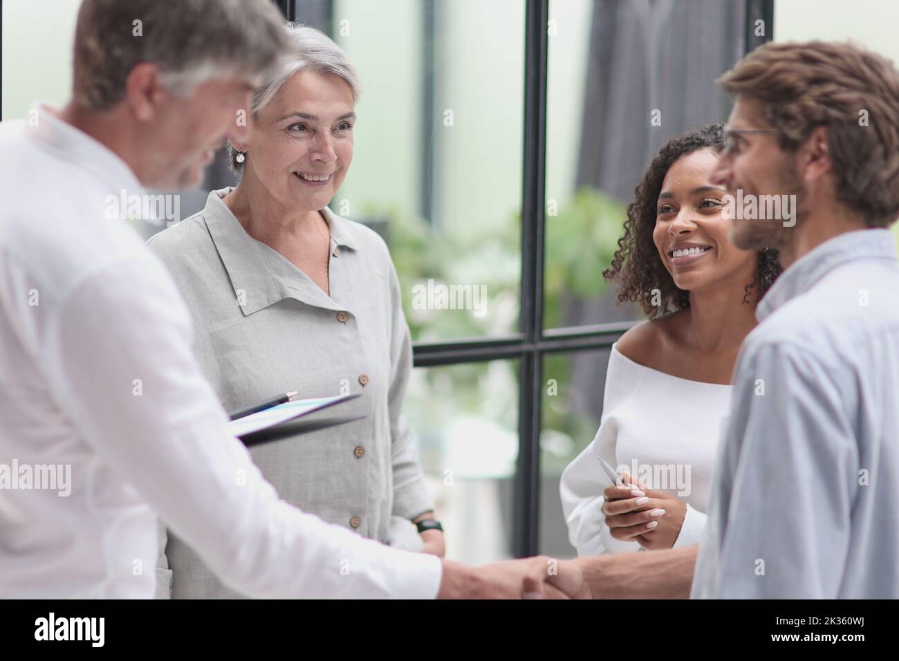 Conversation between managers and employees in the office Stock Photo ...