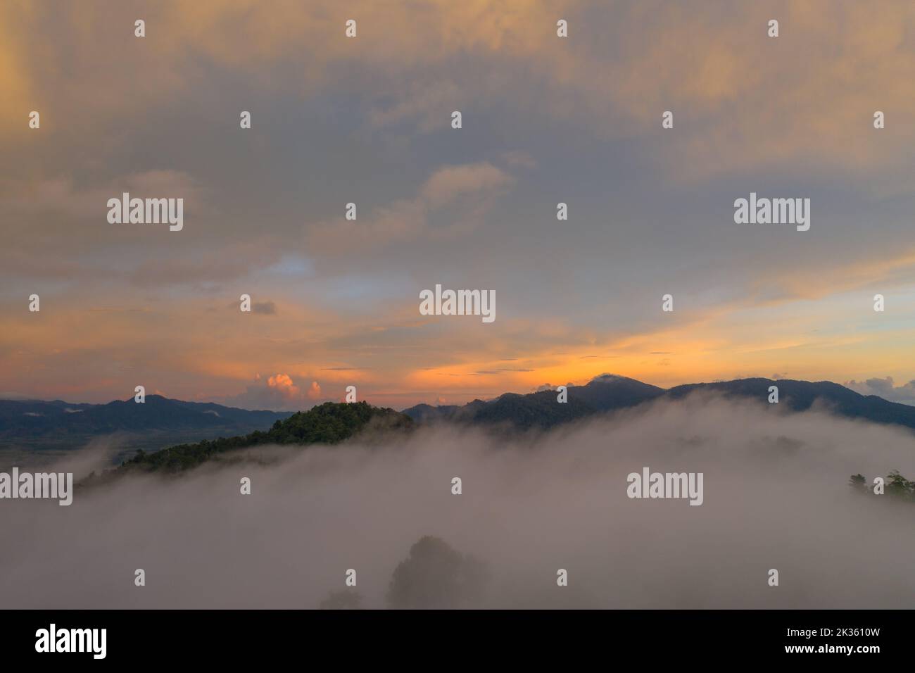aerial view multicolored sky above the sea of mist. A sea of mist ...