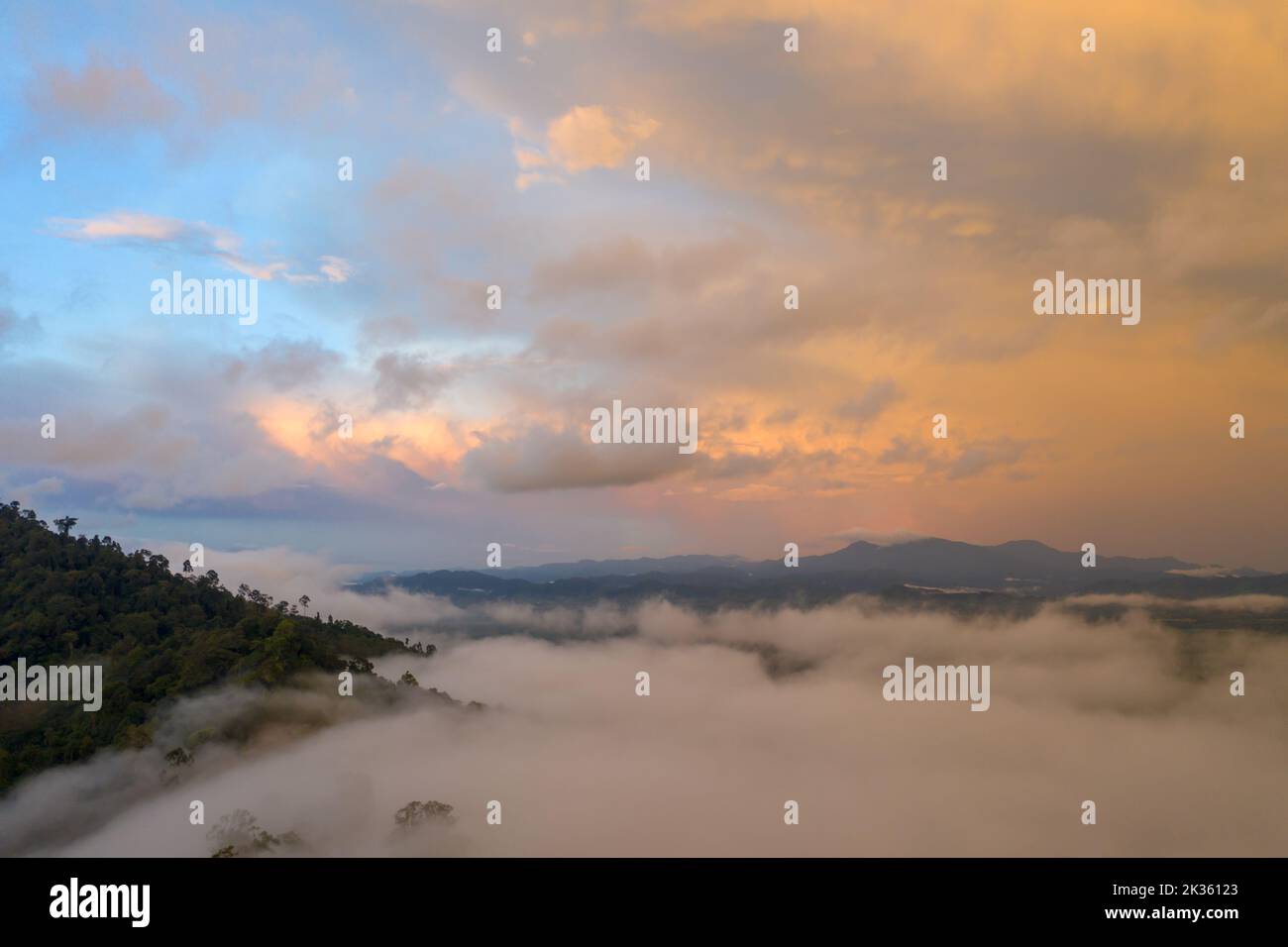 aerial view multicolored sky above the sea of mist. A sea of mist ...