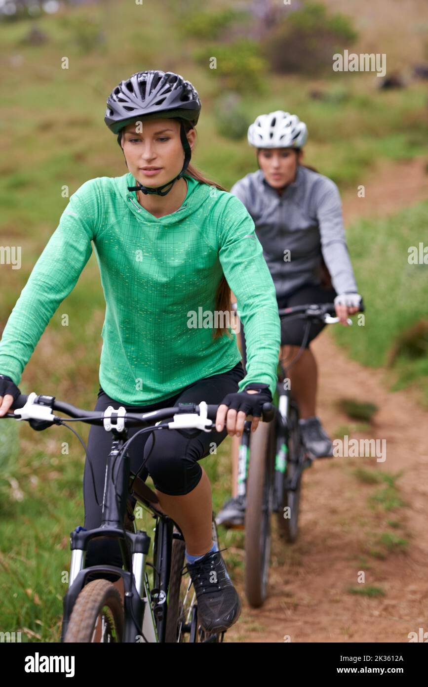Biking with my best friend. Two young cyclists enjoying their ride ...