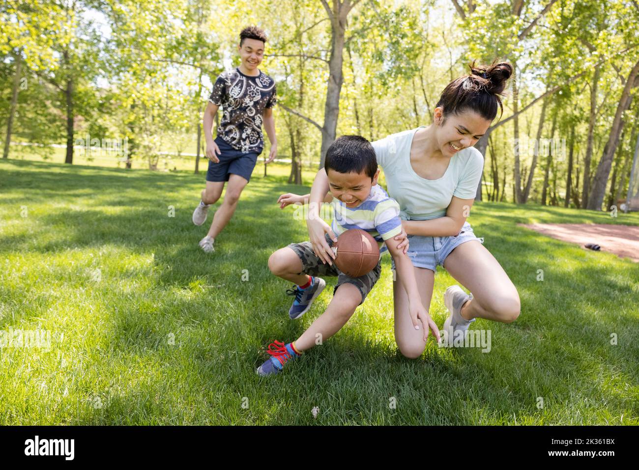 Football at park hi-res stock photography and images - Alamy