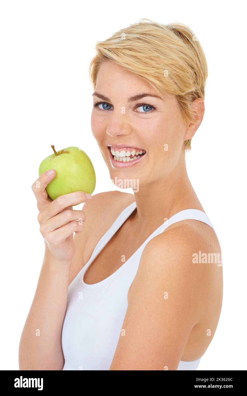 She has to stick to her eating plan. a young woman holding an apple ...