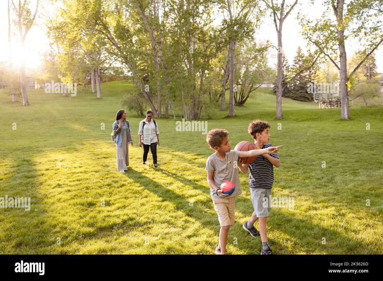 Woman carrying basketball hi-res stock photography and images - Alamy