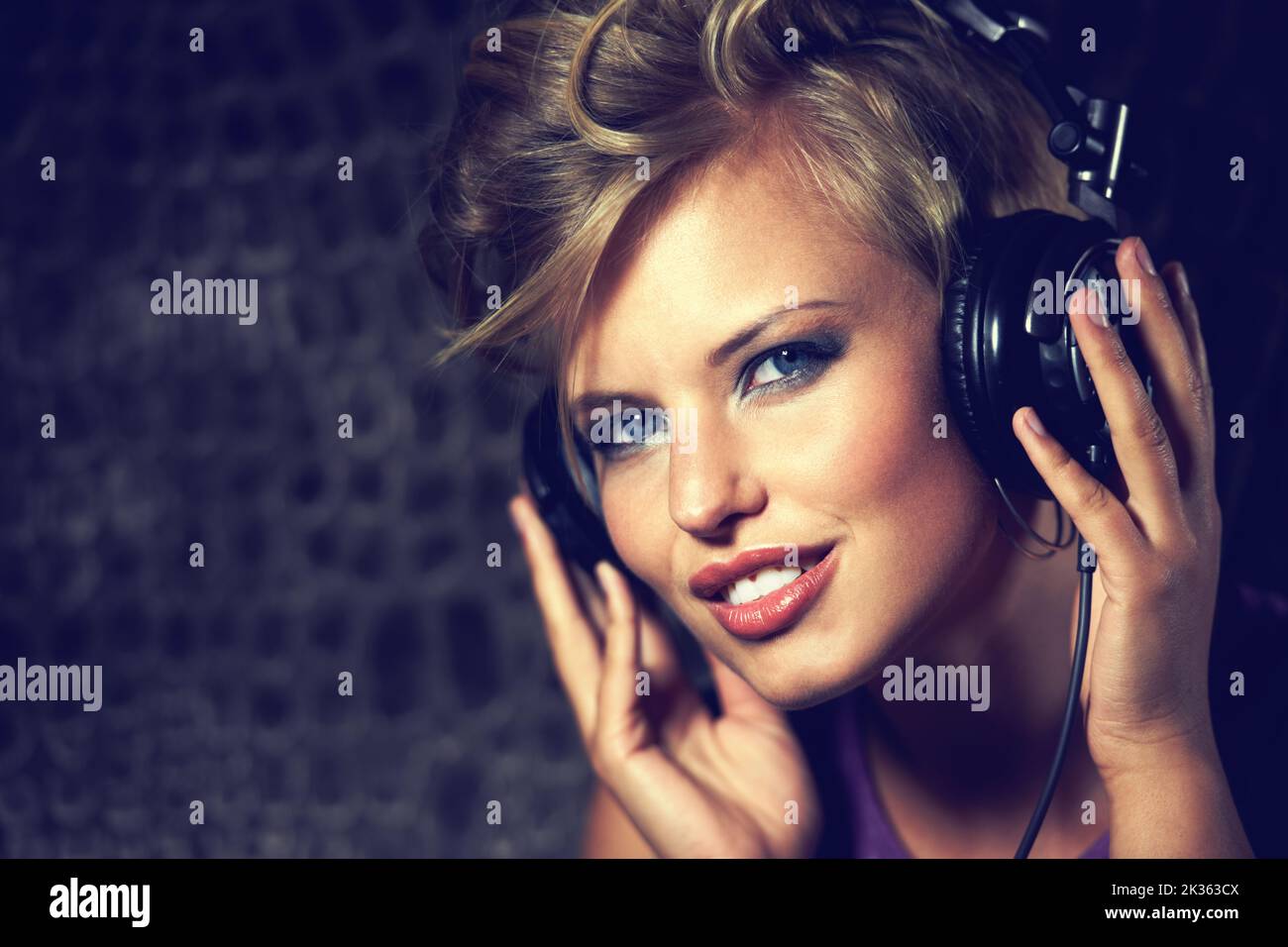 Her beats will blow your mind. a gorgeous young female dj Stock Photo ...