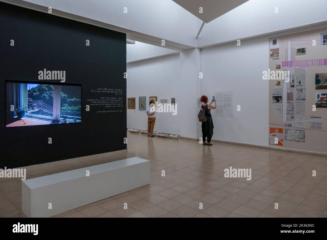 Visitors view artwork by Israeli artists inside the Mishkan Museum of ...
