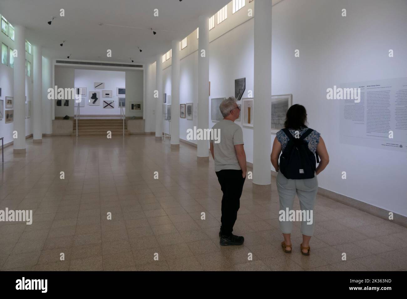 Visitors view artwork by Israeli artists inside the Mishkan Museum of ...