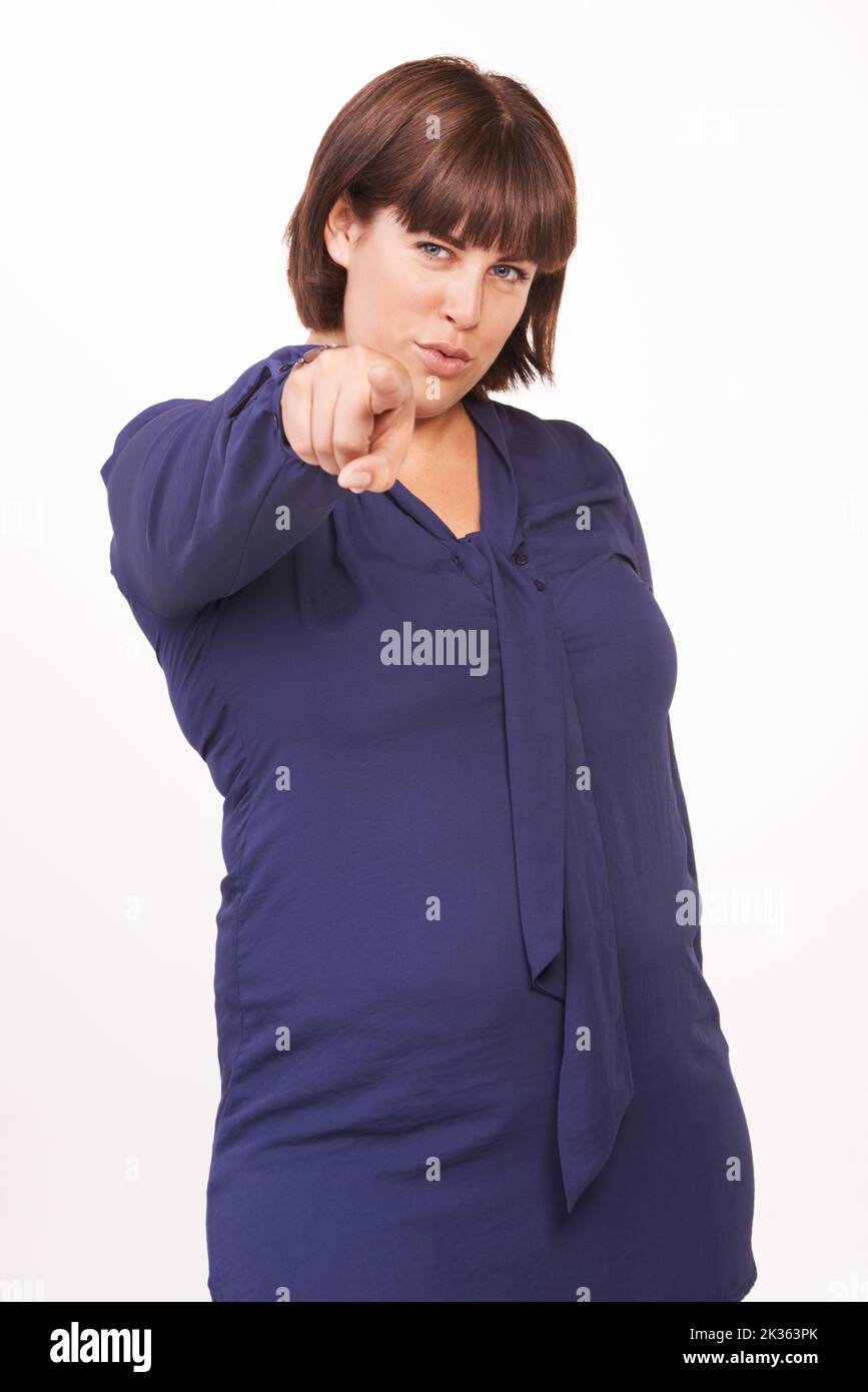 Pointing the way to success. Portrait of a pretty young brunette woman ...