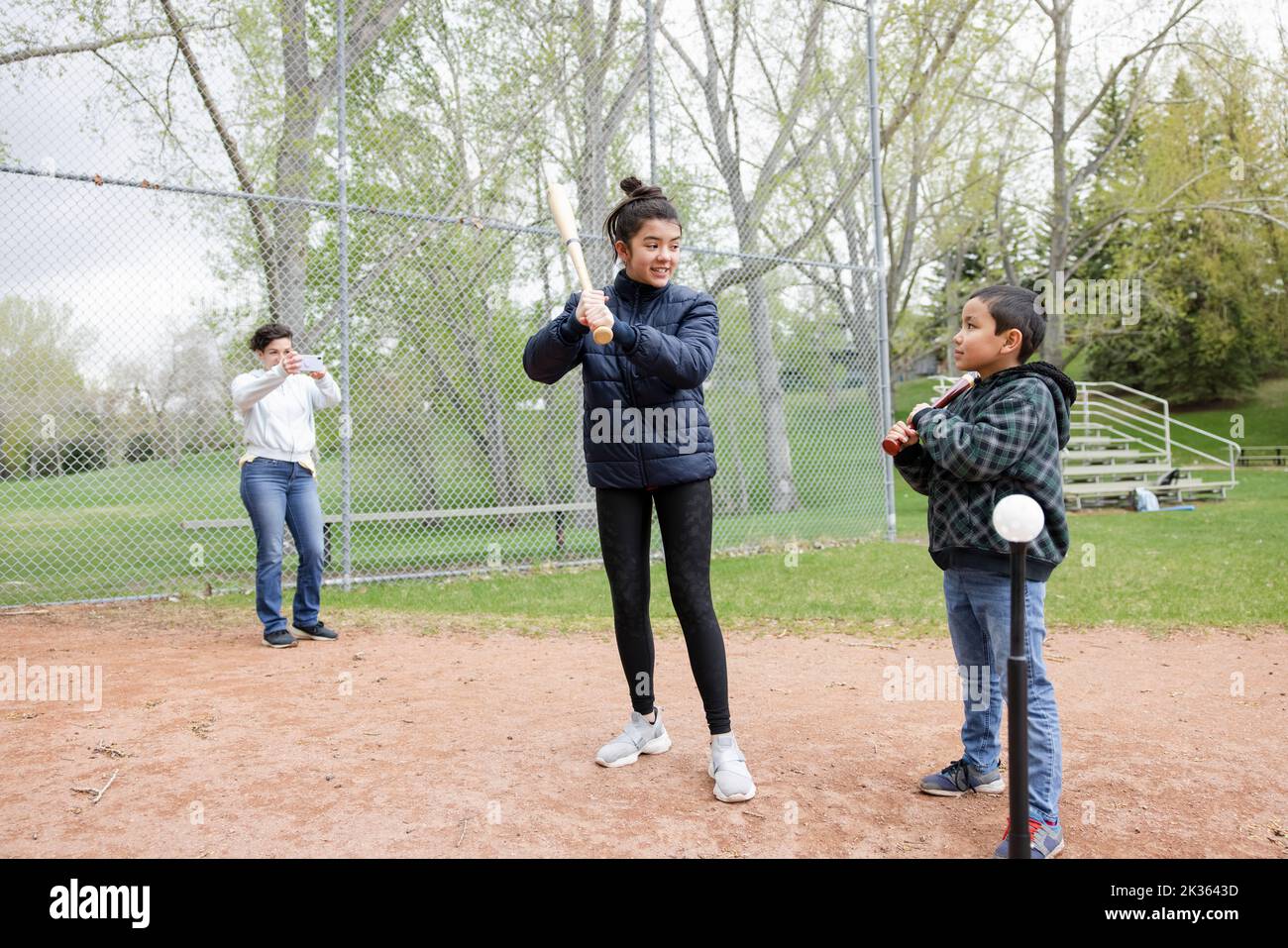 Girl batting baseball hi-res stock photography and images - Alamy