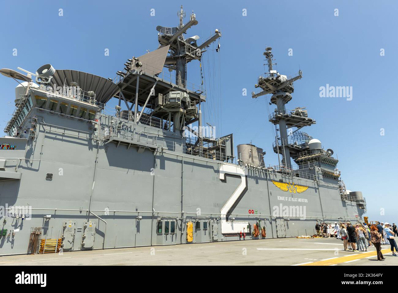 The beware of jet blast and rotors sign on the deck of the USS Bonhomme ...