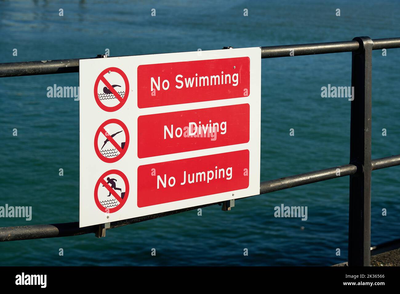 The no swimming, no diving, and no jumping sign Stock Photo - Alamy