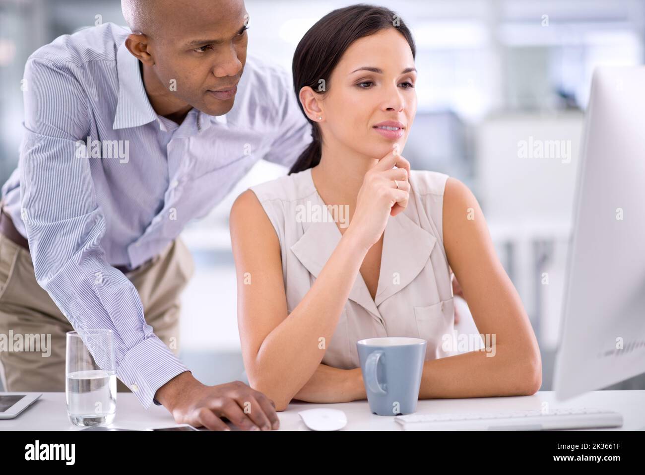 Id like your opinion on this feature...Two businesspeople conferring ...