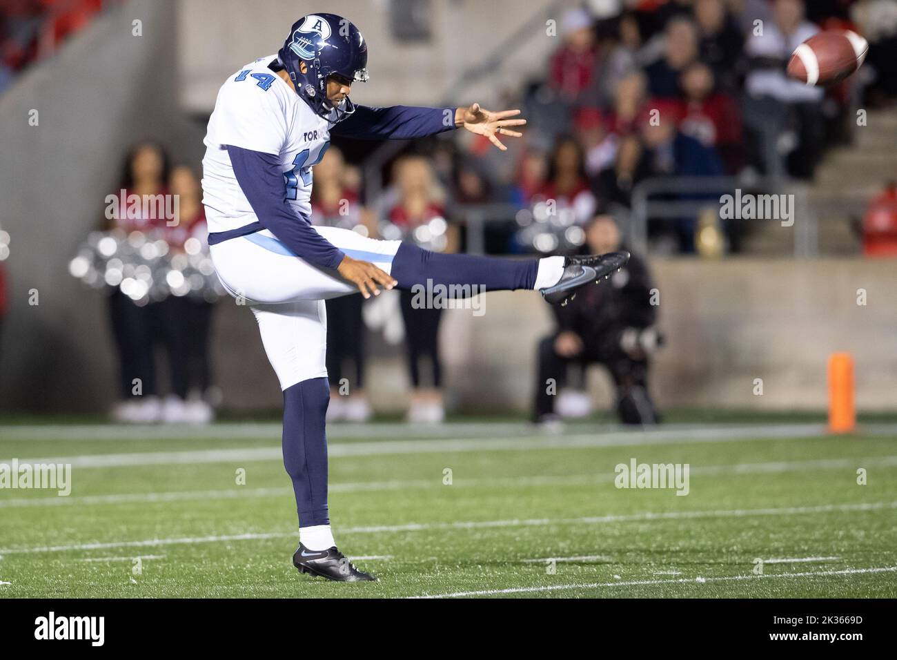 September 24, 2022: Toronto Argonauts kicker Boris Bede (14) punts ...