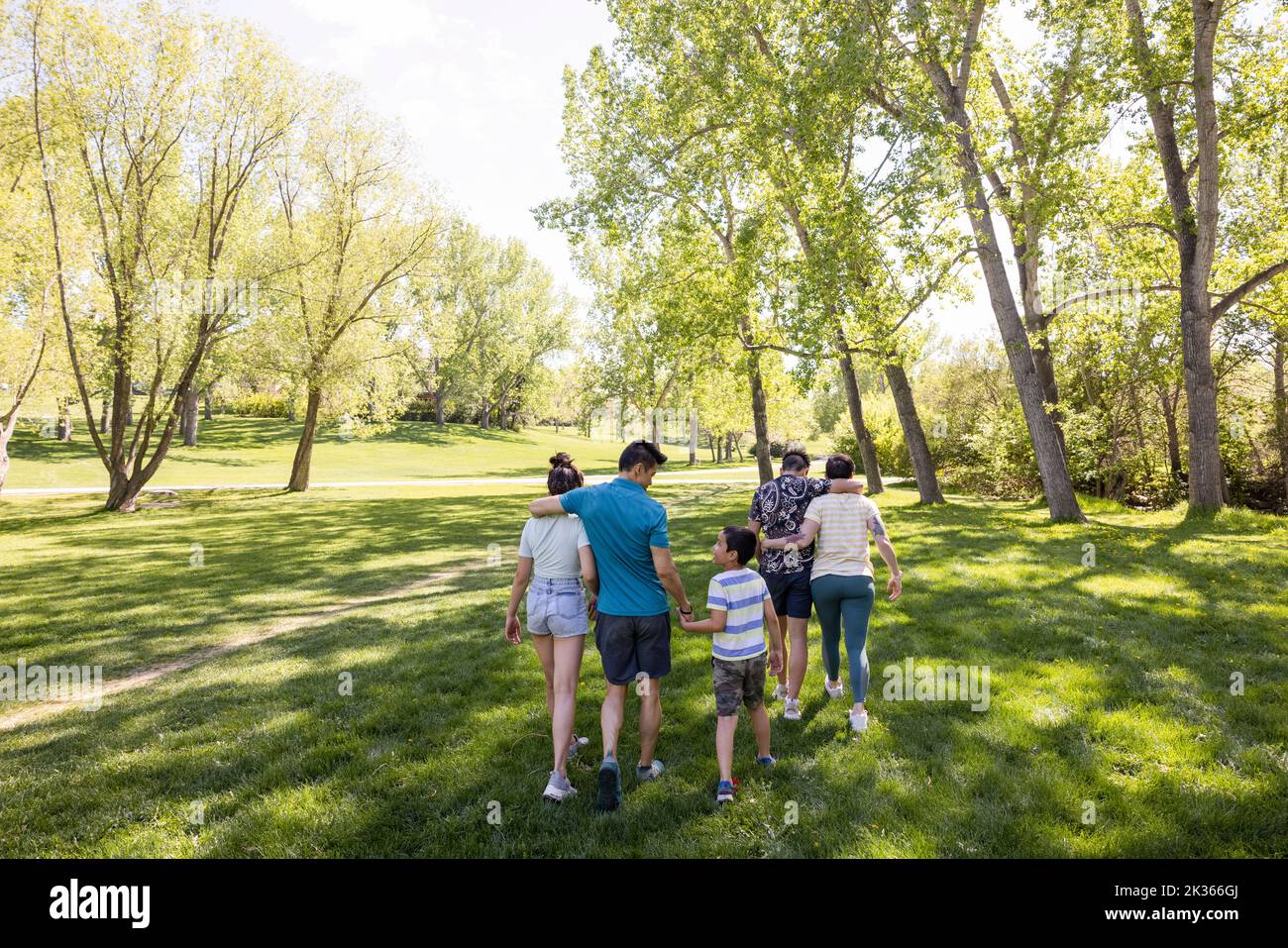 Family group walking together hi-res stock photography and images - Alamy