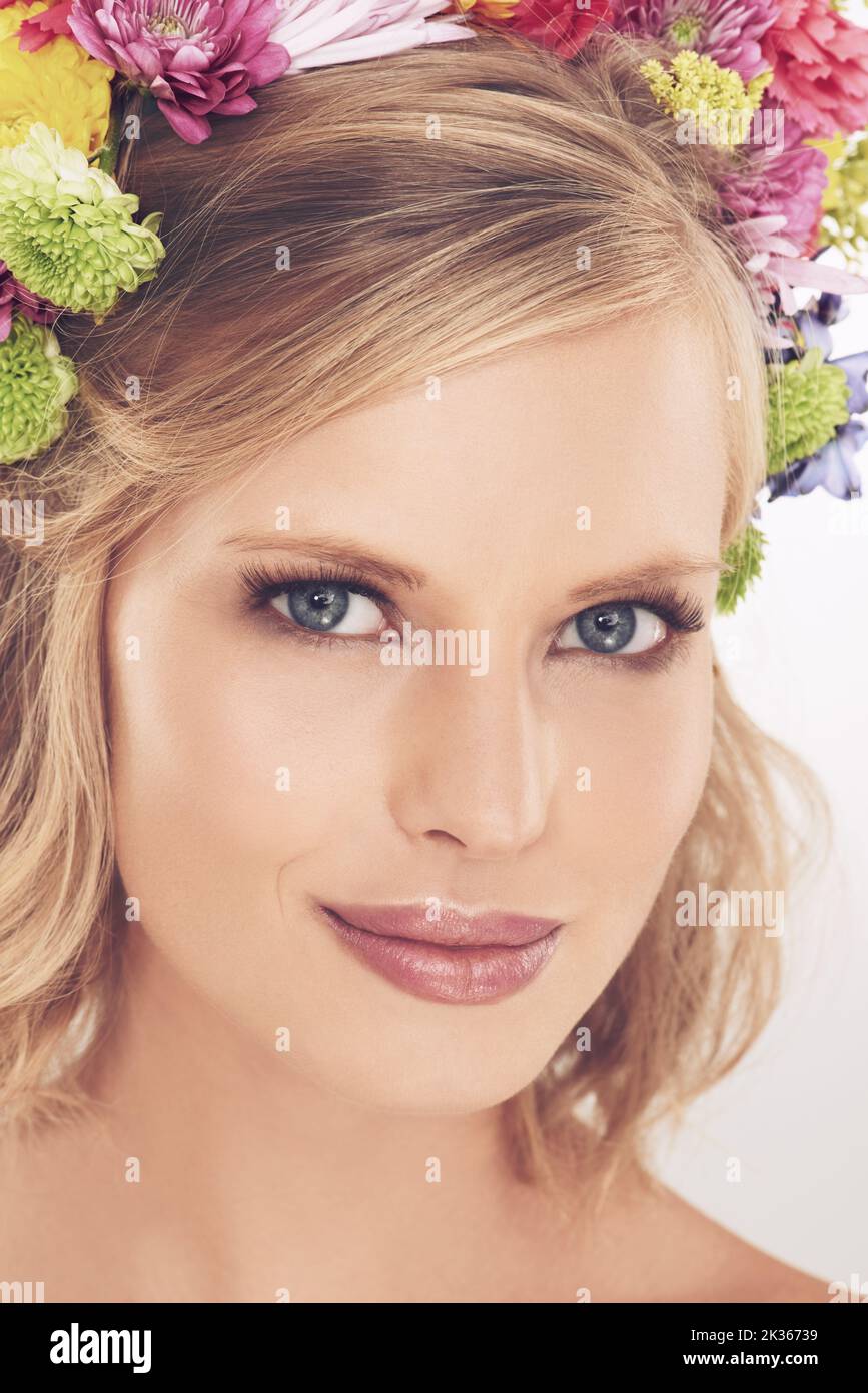 Her true beauty shines through. A young woman with a flower arrangement ...