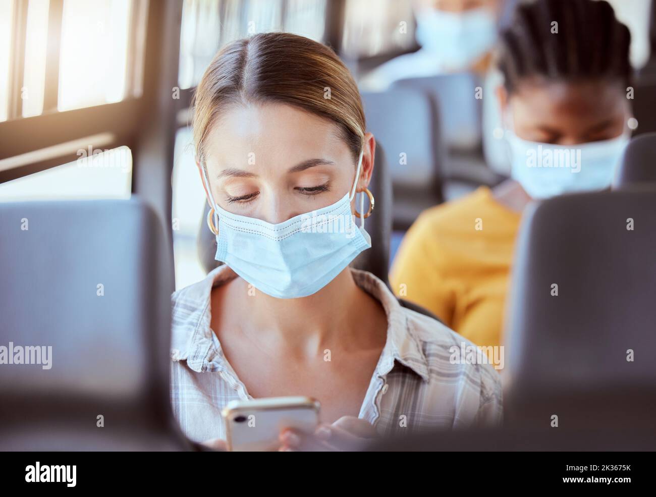 Covid, travel and woman with mask on bus with phone with, social media ...