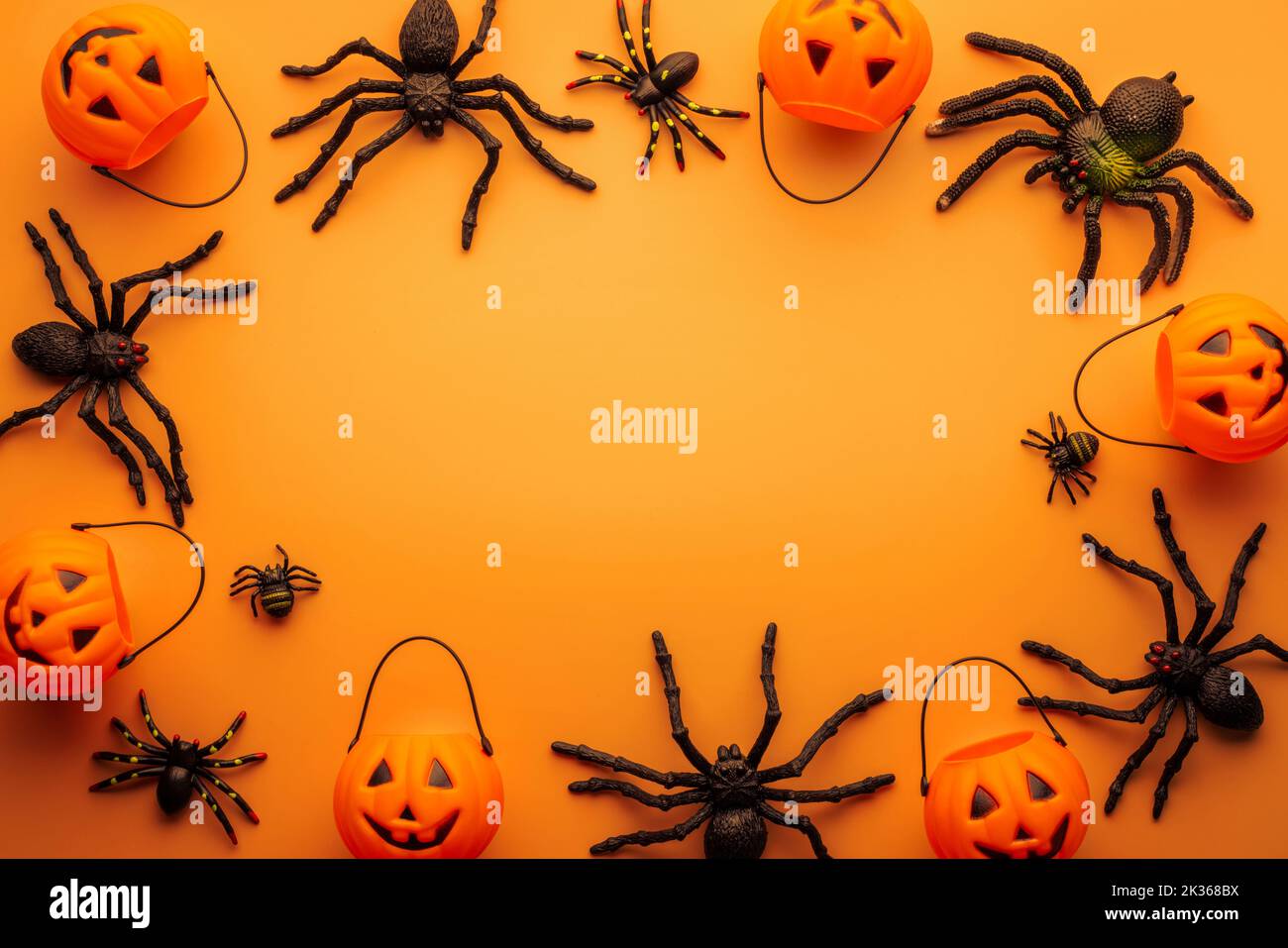 Halloween decorations, pumpkins, spiders on orange background Stock ...