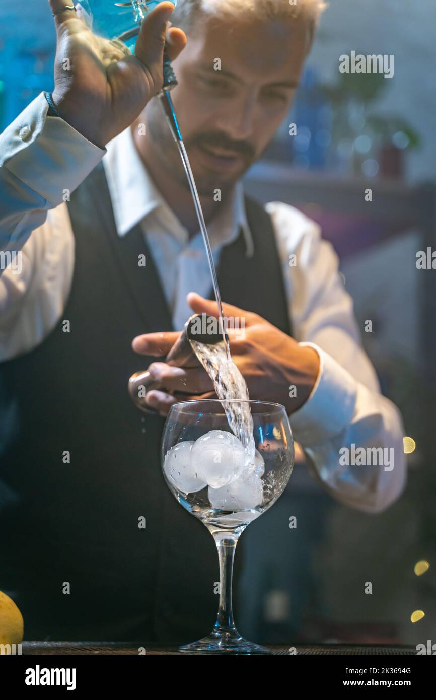 Professional barman in white shirt hi-res stock photography and images ...