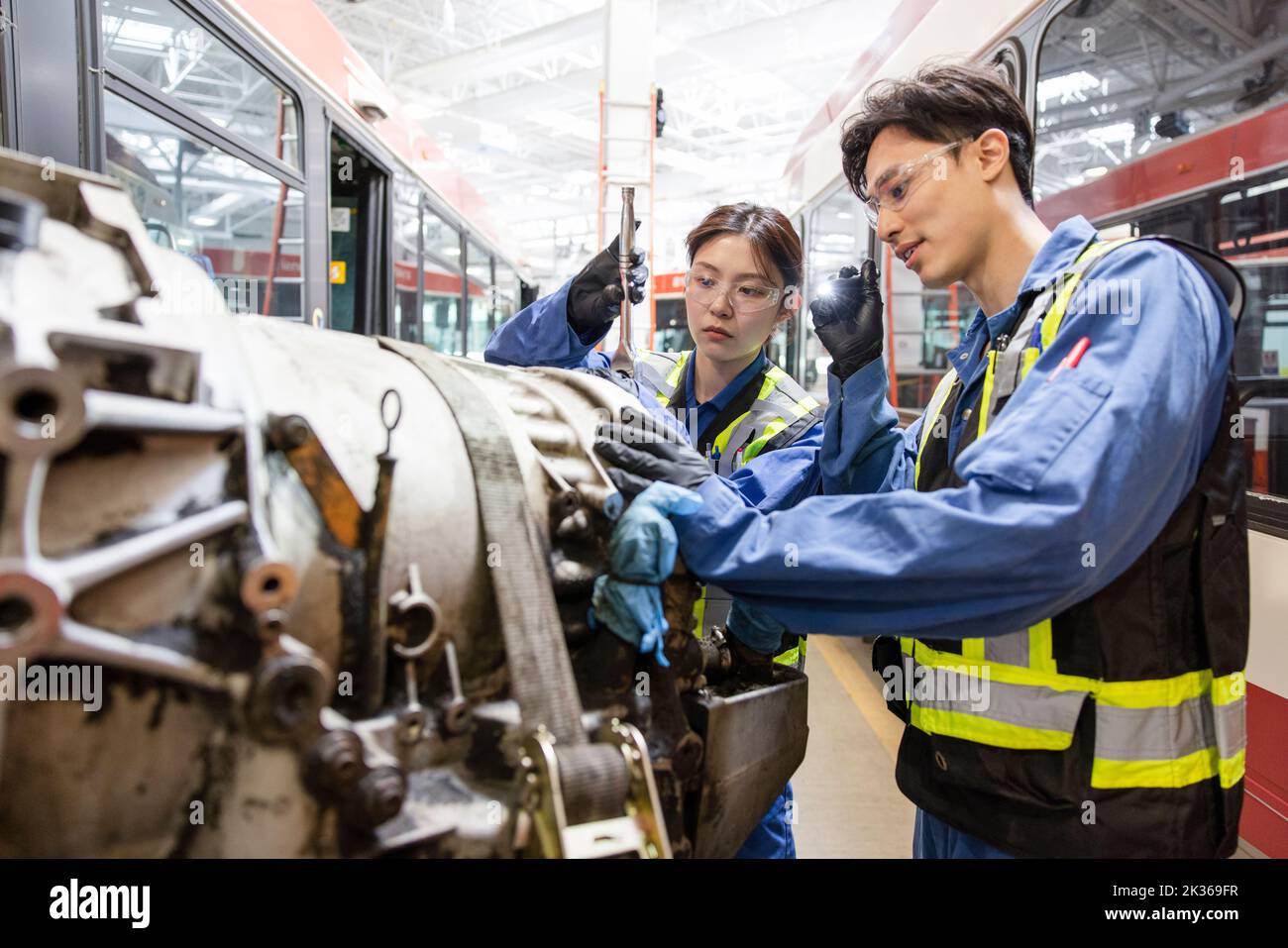 Standing transportation examining teamwork hi-res stock photography and ...