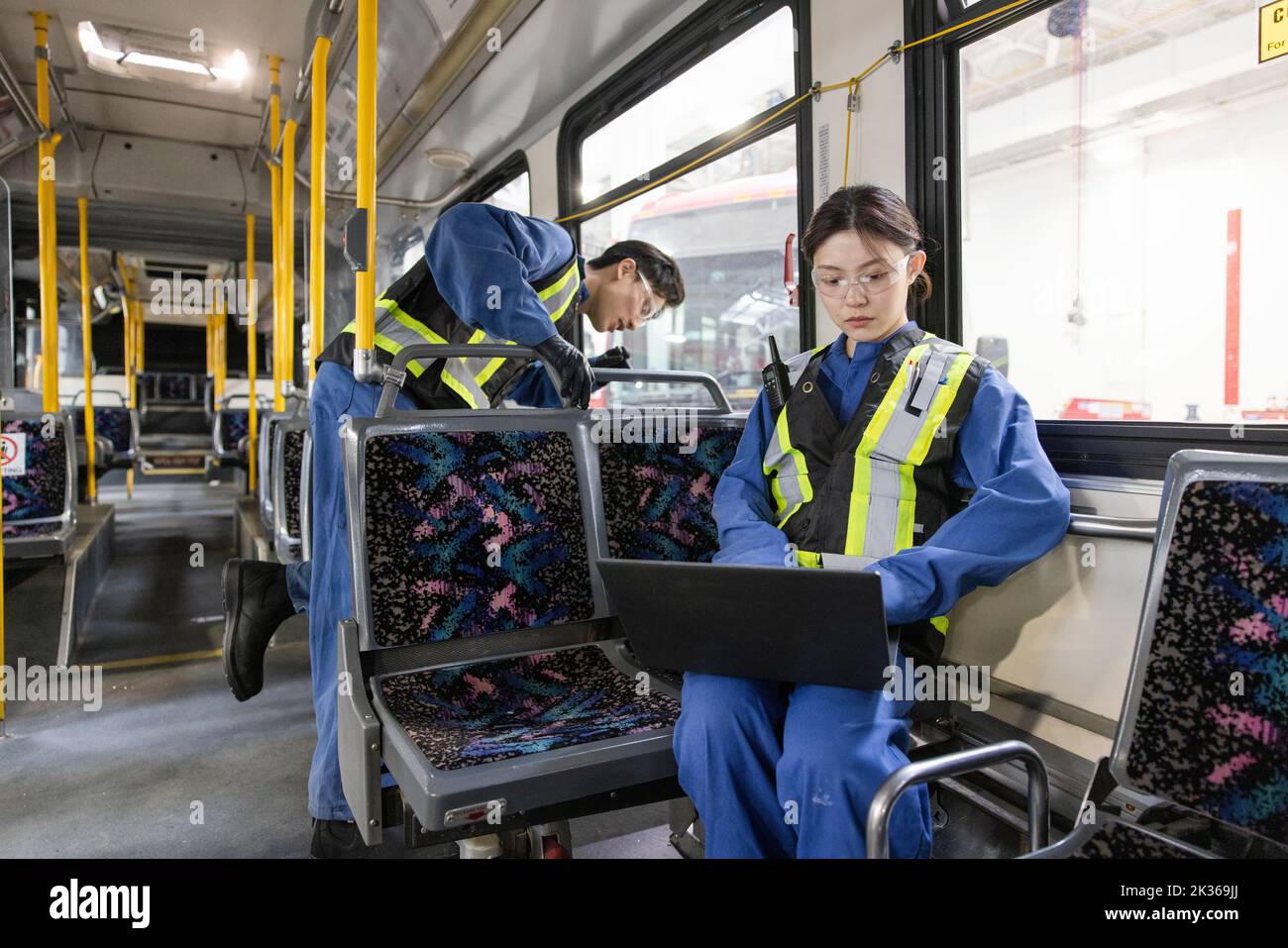 People with laptop inside bus hi-res stock photography and images - Alamy