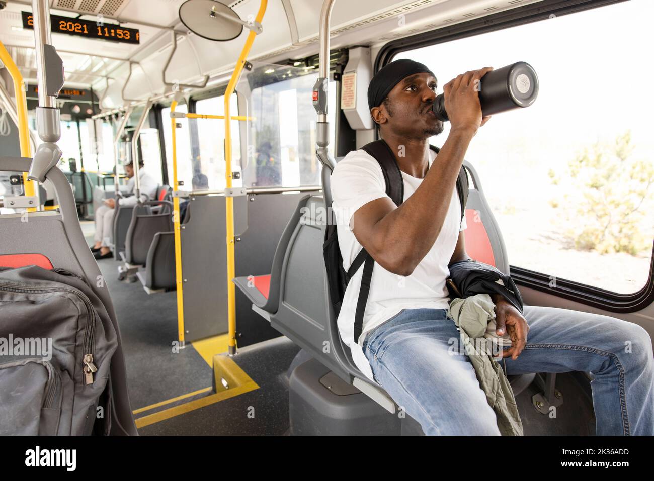 Young man sitting on bus hi-res stock photography and images - Alamy