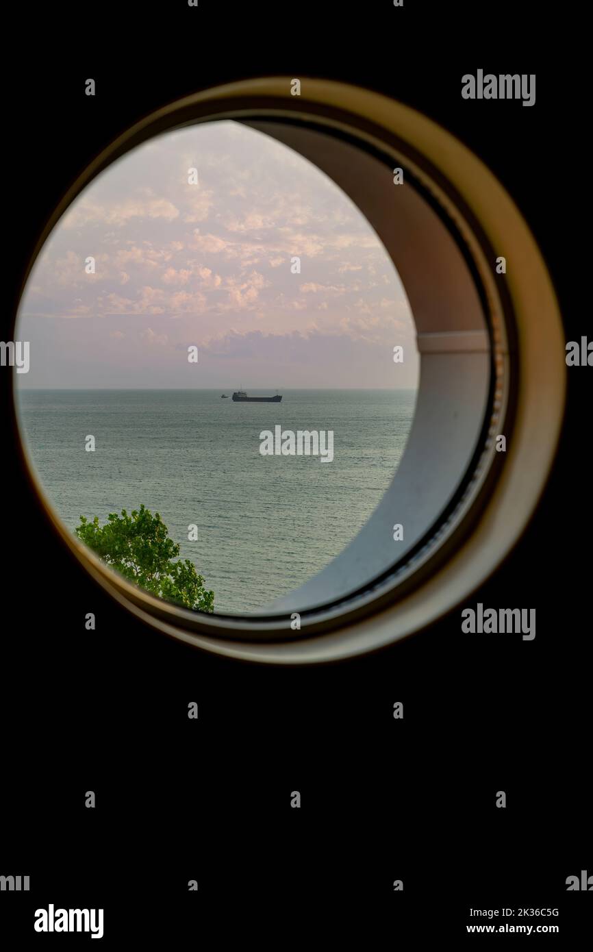 A view from the porthole window of a cruise ship, showing a ship Stock ...