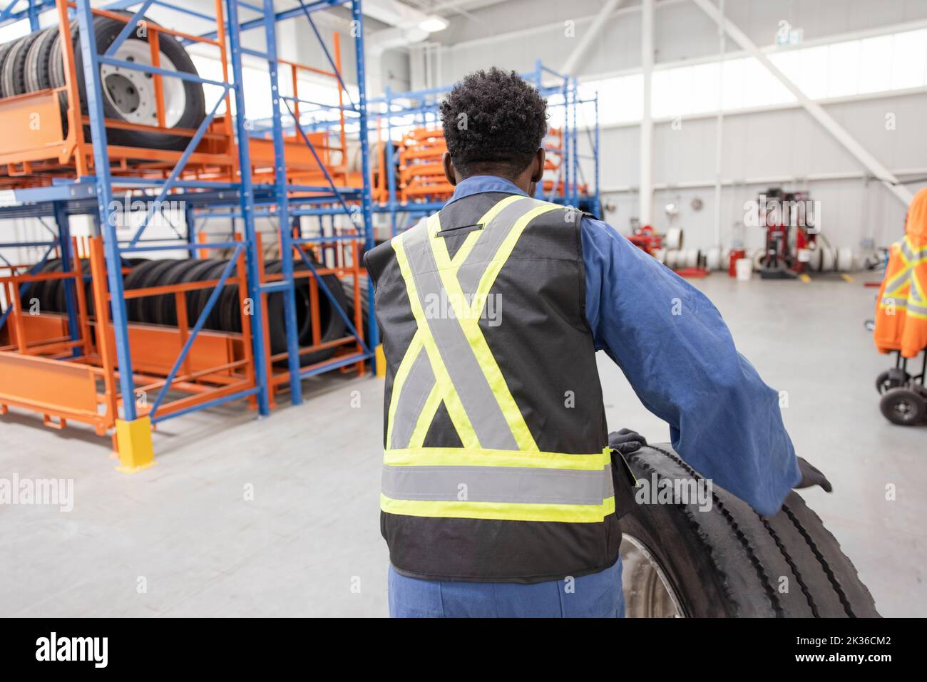 Rolling a tire hi-res stock photography and images - Alamy