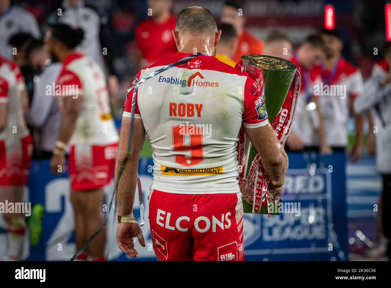 James Roby #9 of St Helens carries the grand final trophy after the ...
