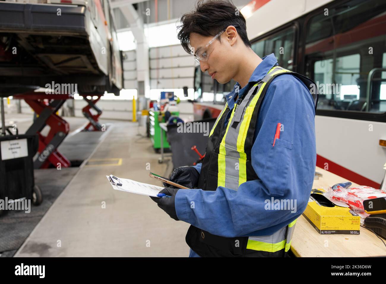 Asian male adult reading bus hi-res stock photography and images - Alamy