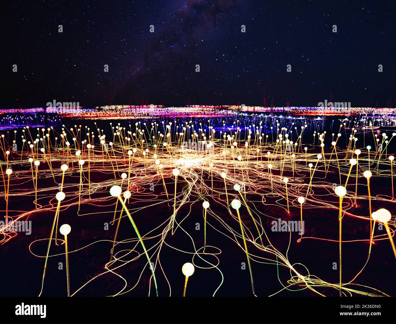 A field of light Uluru under a starry sky in Yulara, Australia Stock ...
