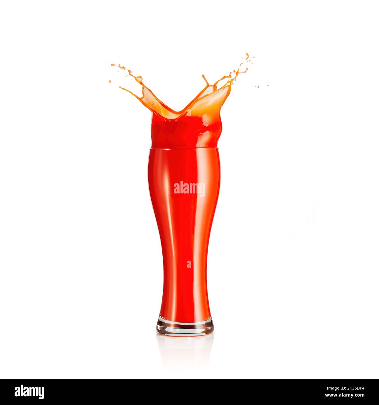 splash of tomato juice isolated on white background. juice in glass ...