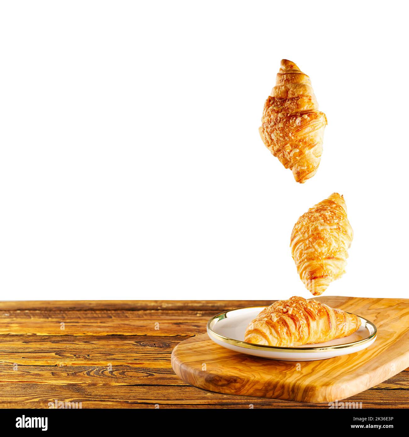 Falling fresh baked croissants with cheese. French pastry concept. copy ...