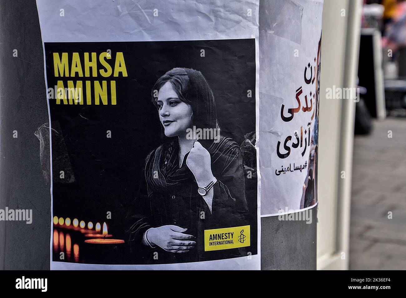 Marseille, France. 24th Sep, 2022. Photos of Mahsa Amini hang on a wall ...