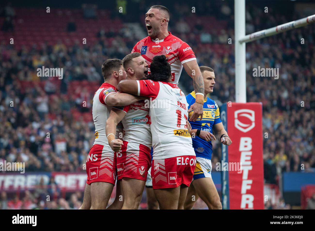 Matty Lees #10 of St Helens celebrates his try with his team mates and ...
