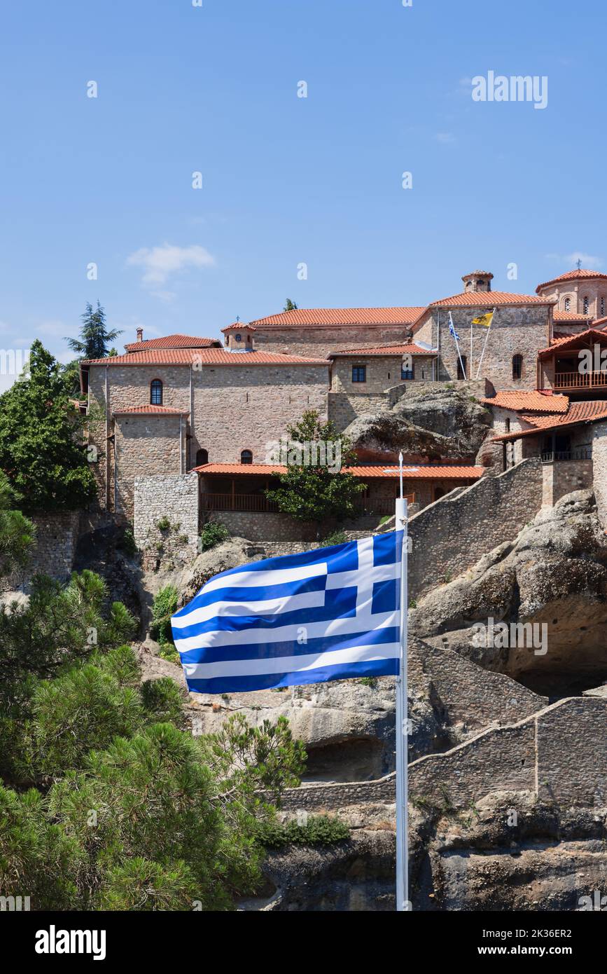 Waving Greek flag in front of Great Meteoron Monastery. Meteora, Greece ...